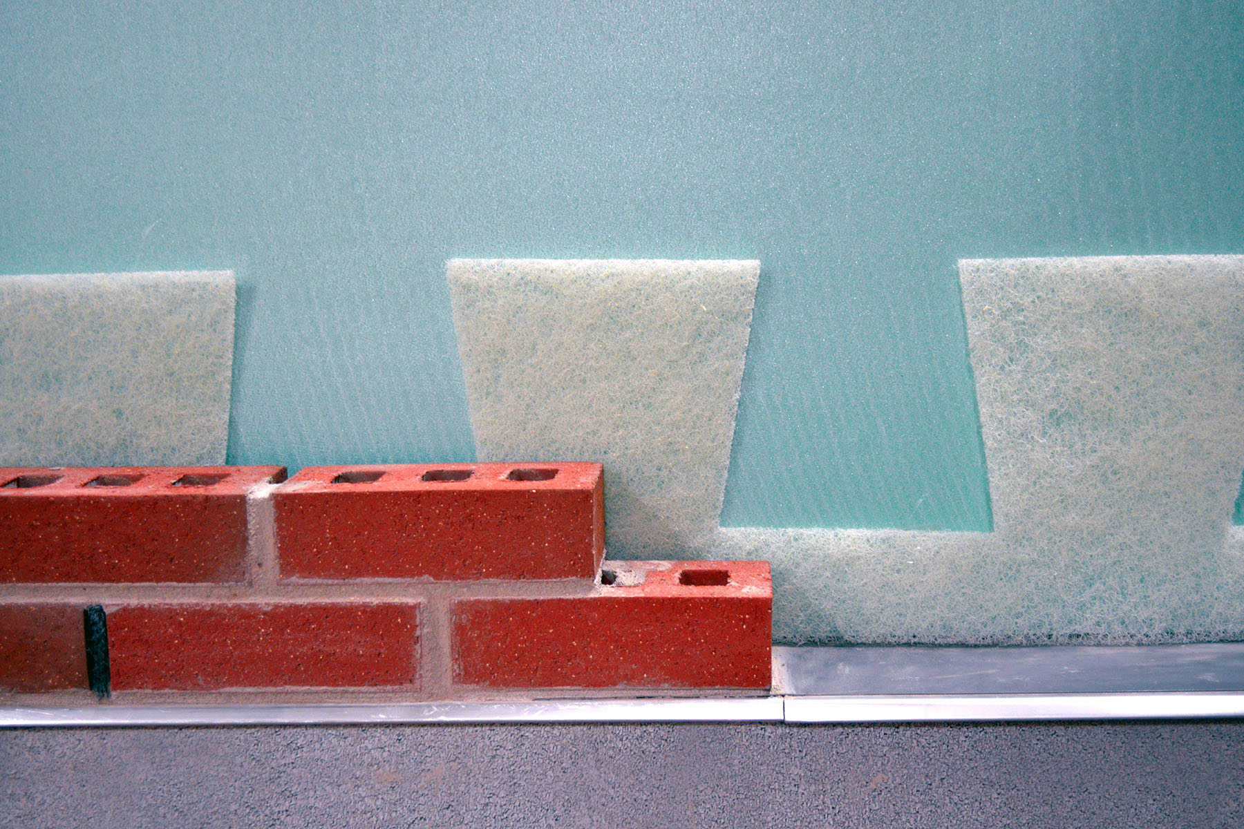 Wall Defender Keeps Weep Holes Clear in Masonry Walls