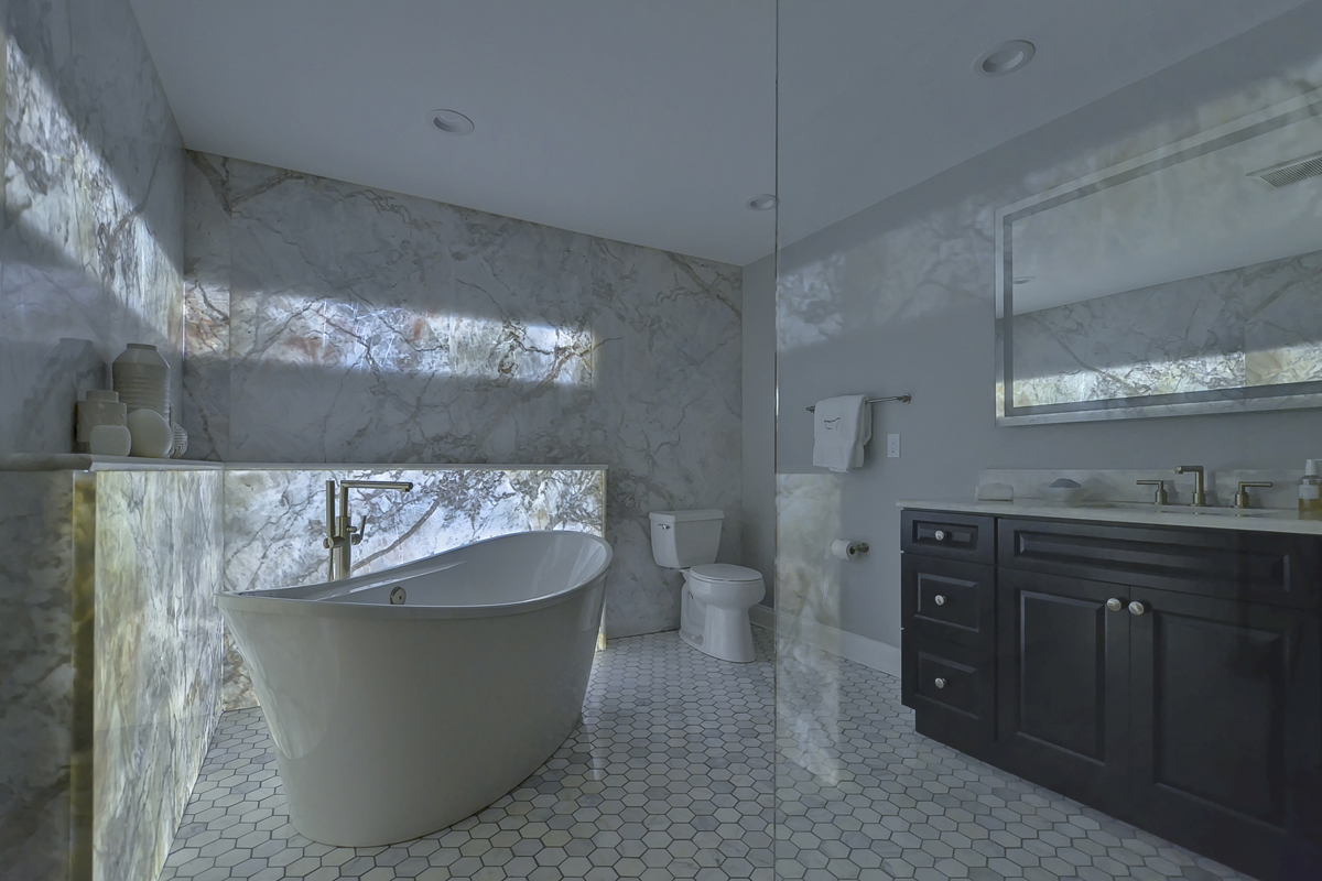 A Backlit Marble Wall Gives This Guest Bath Its 'Wow' Factor