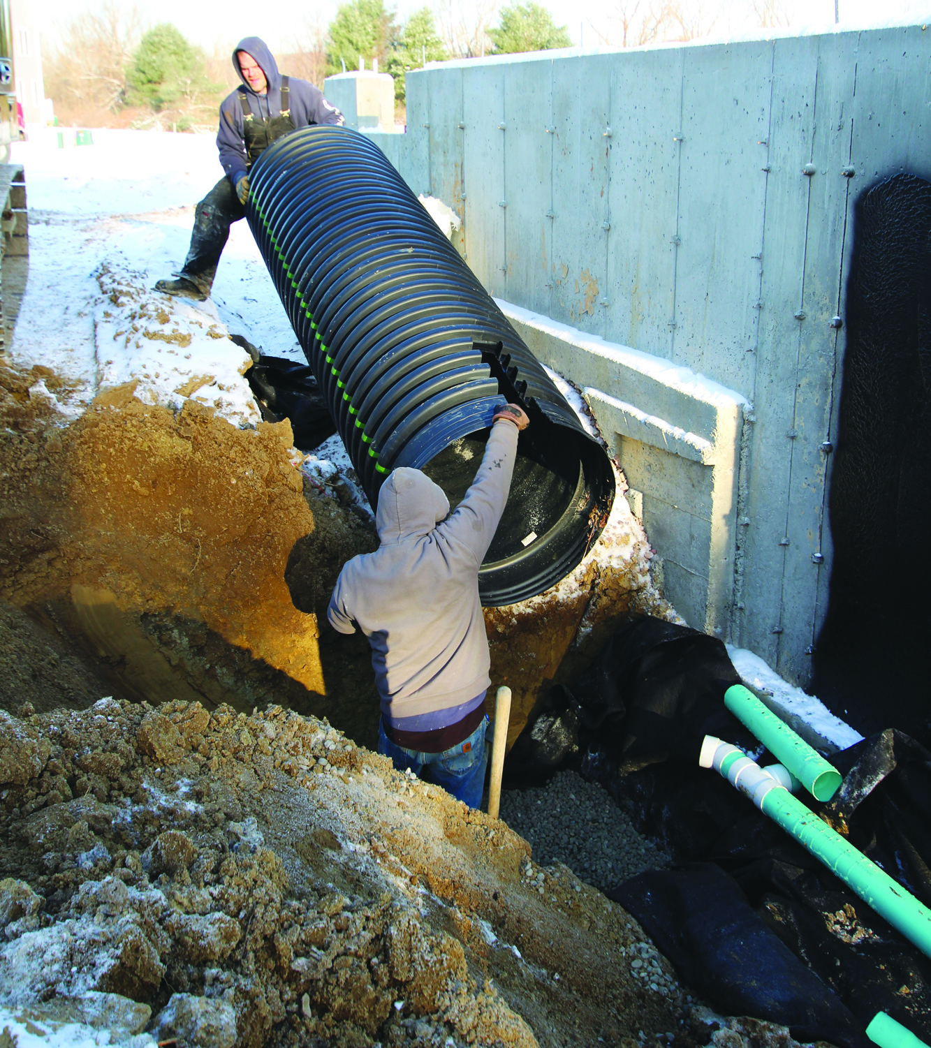 Pumping to Daylight: Foundation Drainage for a Low-Lying Site