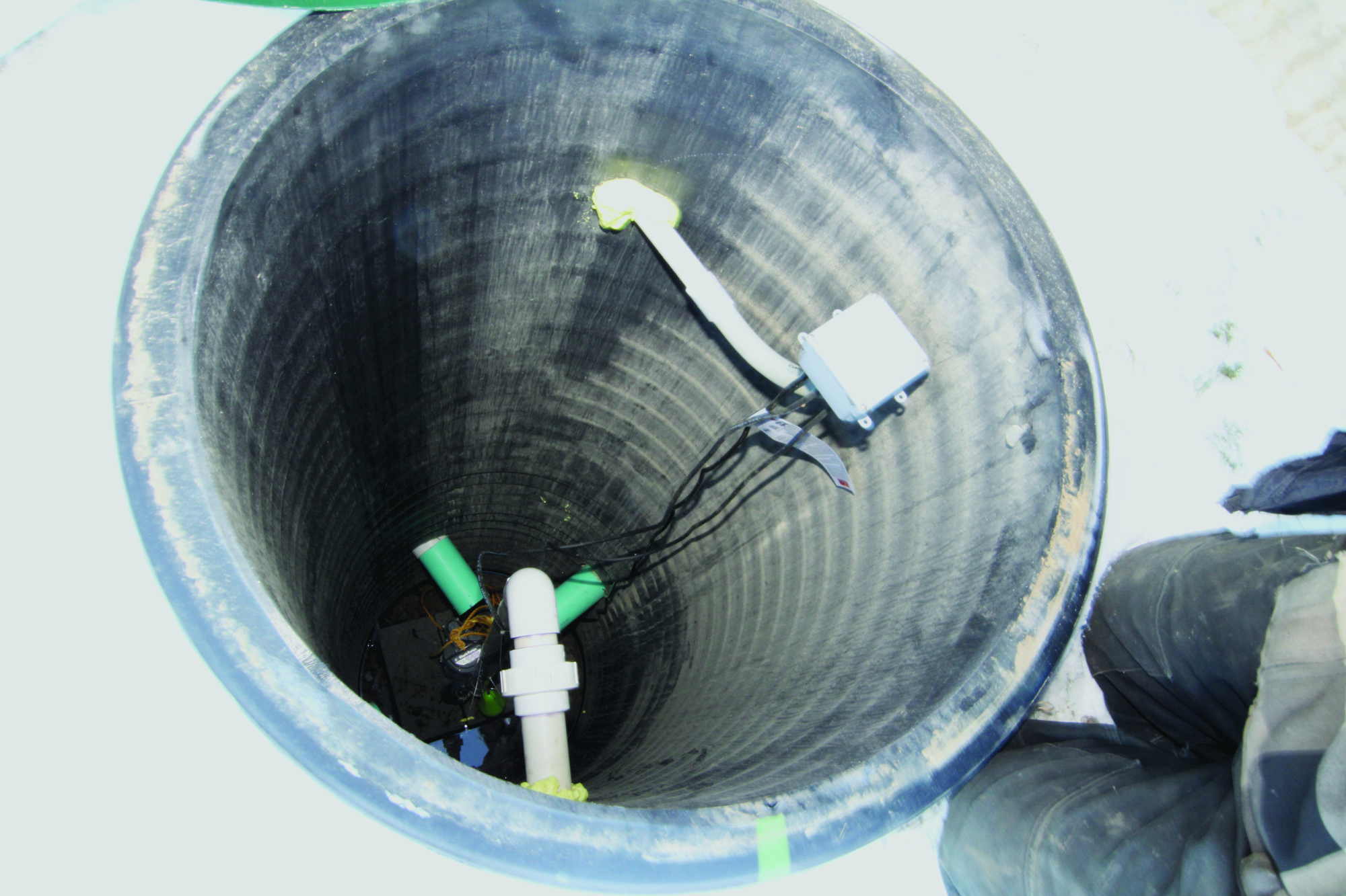 Pumping to Daylight: Foundation Drainage for a Low-Lying Site