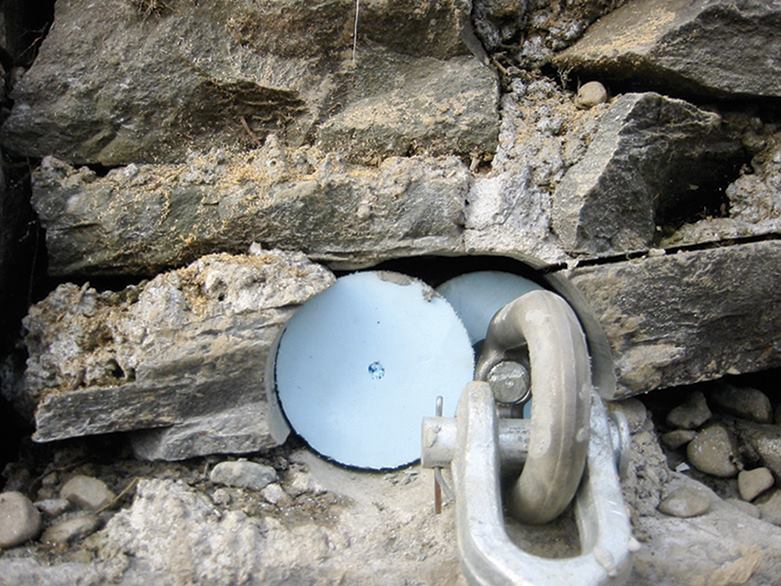 Straightening a Stone Wall With Steel Pins and Helical Tiebacks