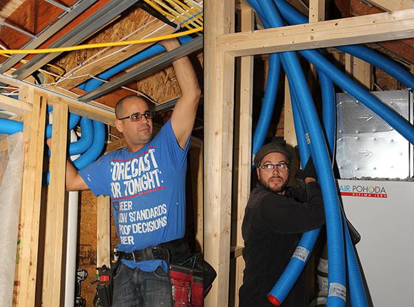 Installing an ERV in a Two-Family Passive House