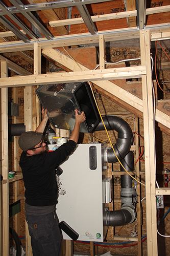 Installing an ERV in a Two-Family Passive House
