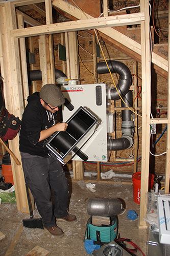 Installing an ERV in a Two-Family Passive House