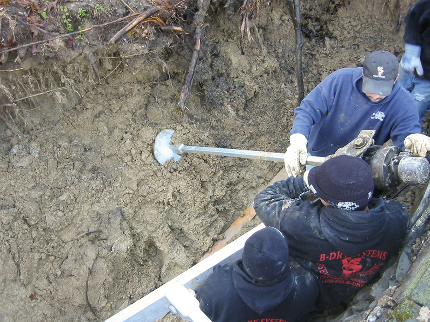 Straightening a Stone Wall With Steel Pins and Helical Tiebacks