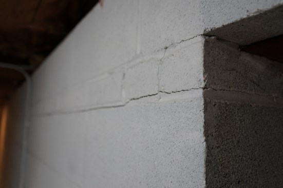 Reinforcing a Foundation with Structural Strapping